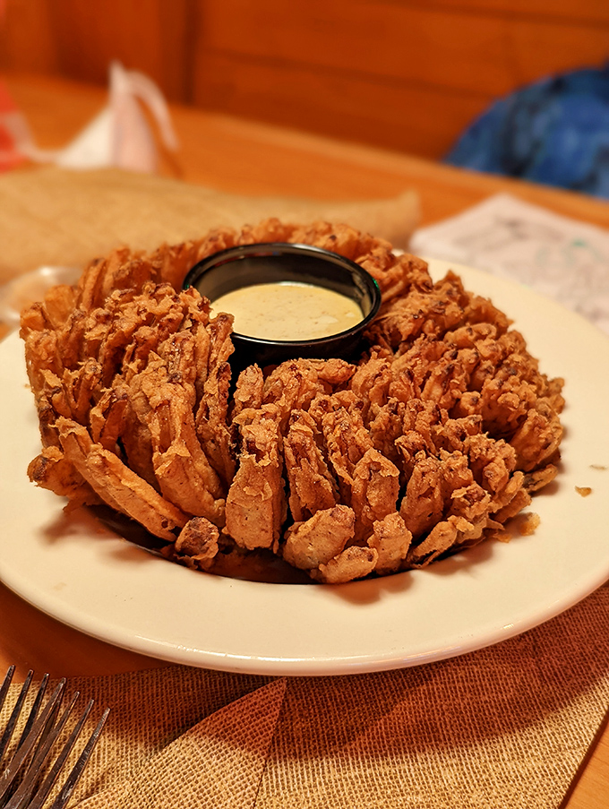 The Blooming Onion: nature's flower reimagined as a crispy, golden monument to deep-fried perfection.