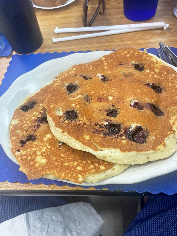 These blueberry pancakes aren't just breakfast&mdash;they're edible nostalgia, dotted with berries that pop with each bite. Summer on a plate.
