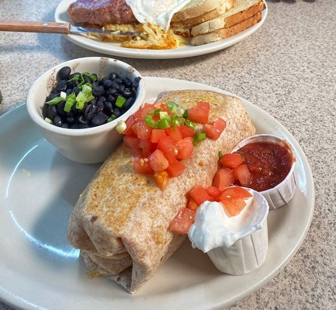 This breakfast burrito arrives like a well-wrapped present, except instead of a toy, you get beans, eggs, and all the fixings your morning deserves.