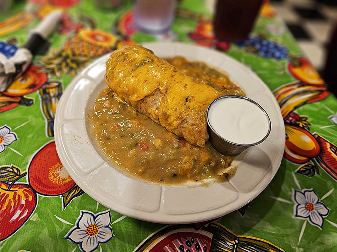 Not all heroes wear capes—some come wrapped in tortillas. This breakfast burrito, smothered in gravy, is saving mornings one bite at a time.