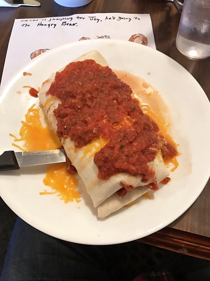 Breakfast burrito nirvana! Smothered in homemade salsa and melted cheese, it's the morning equivalent of being wrapped in a warm hug.