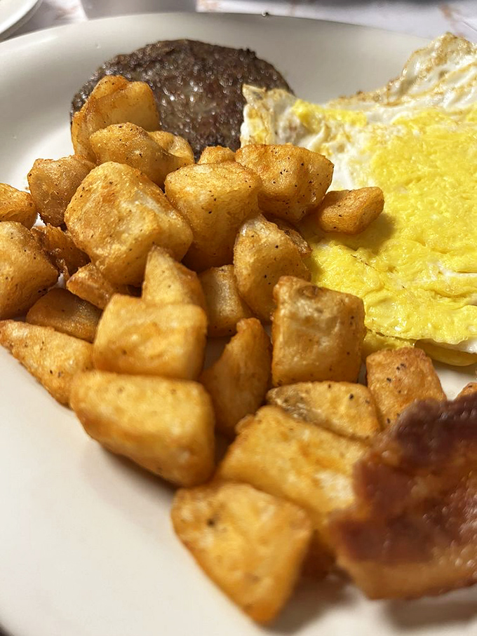 These home fries are the supporting actors that steal the show—crispy edges, tender centers, perfectly seasoned.
