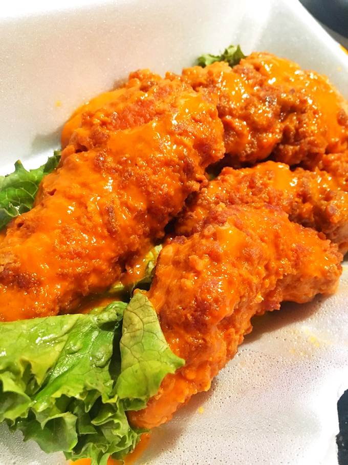 Buffalo tenders that glow with promise. That vibrant orange sauce isn't just showing off&mdash;it delivers heat and flavor in equal measure.