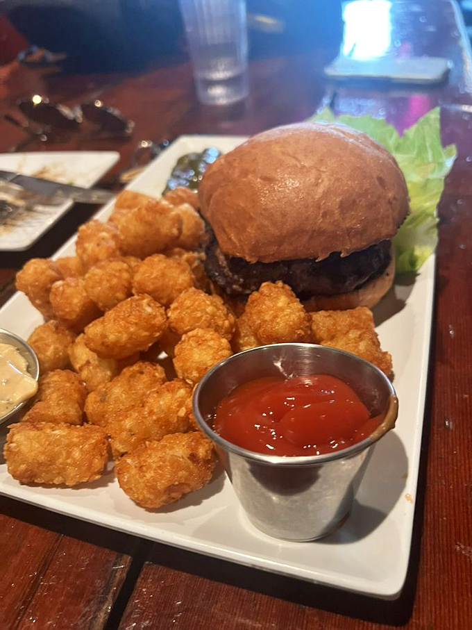 Even the humble burger gets the royal treatment here&mdash;a pillowy bun, juicy patty, and those golden tater tots that crunch like childhood memories.