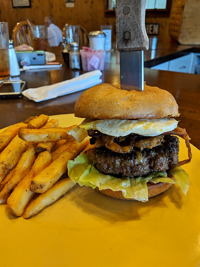 This isn't just a burger&mdash;it's a towering achievement with a knife as its exclamation point. Your diet plan just called to say it's taking the day off.
