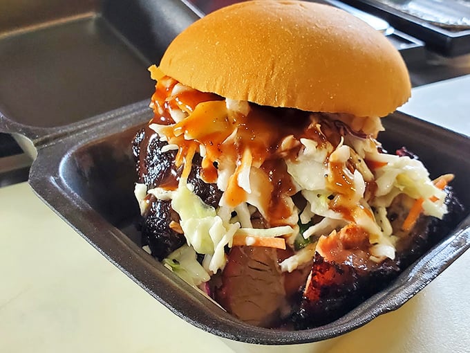 The sandwich equivalent of a standing ovation—brisket, slaw, and sauce performing the ultimate culinary encore.