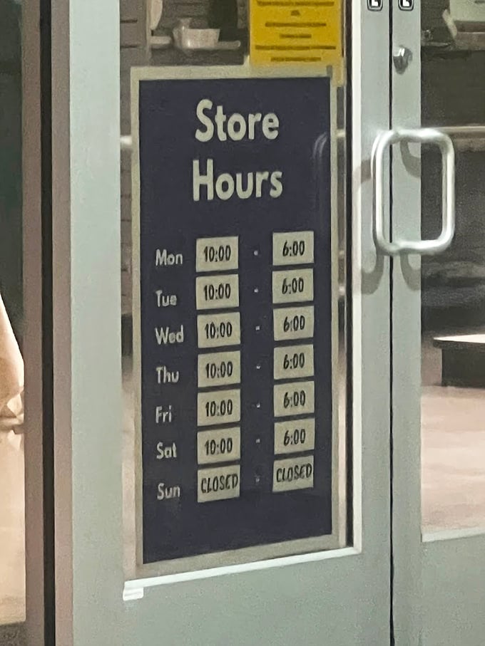 Store hours posted with military precision. The "Closed Sunday" sign is the thrift store equivalent of "Gone Fishin'"&mdash;even bargains need a day off.
