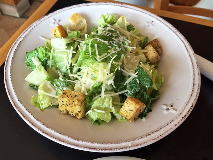 A Caesar salad that Julius himself would approve &ndash; crisp romaine, golden croutons, and a shower of Parmesan that makes you forget you're eating vegetables.