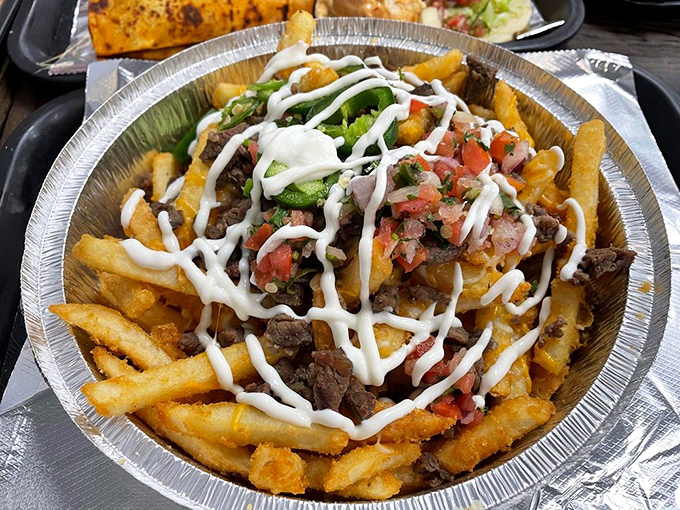 Carne asada fries: where potato meets protein in a cross-cultural masterpiece that makes you wonder why all fries don't come dressed this way.