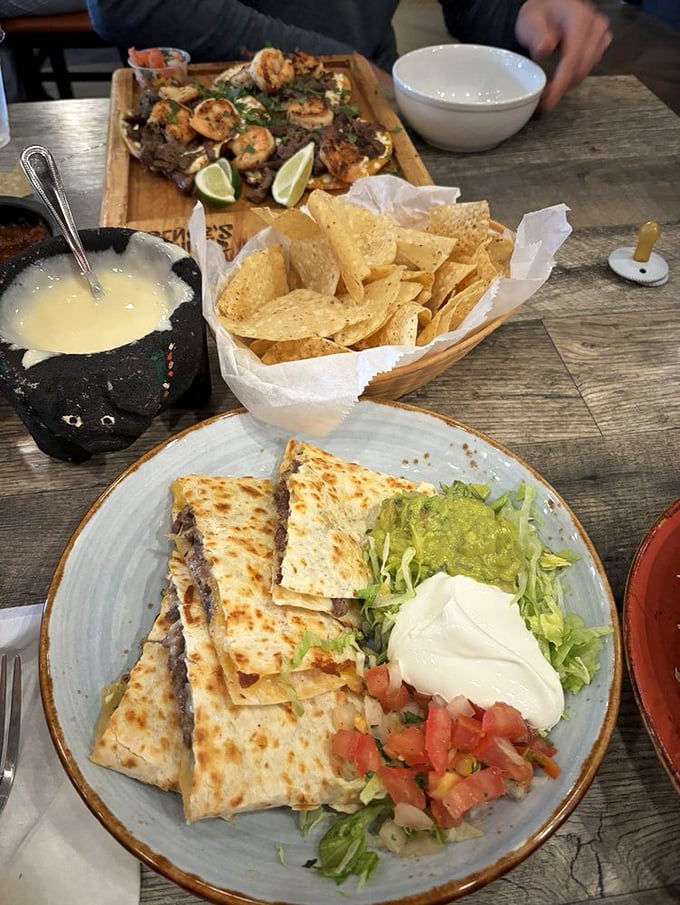 A spread fit for royalty&mdash;molten quesadillas, fresh chips, and that volcanic stone bowl of queso that whispers, "Just one more dip."