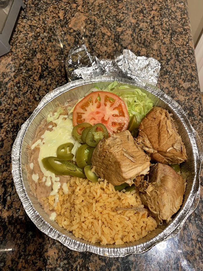 These carnitas aren't just meat&mdash;they're a commitment to flavor. Tender pork nestled alongside rice, beans, and jalape&ntilde;os creates a foil-wrapped fiesta for your taste buds.