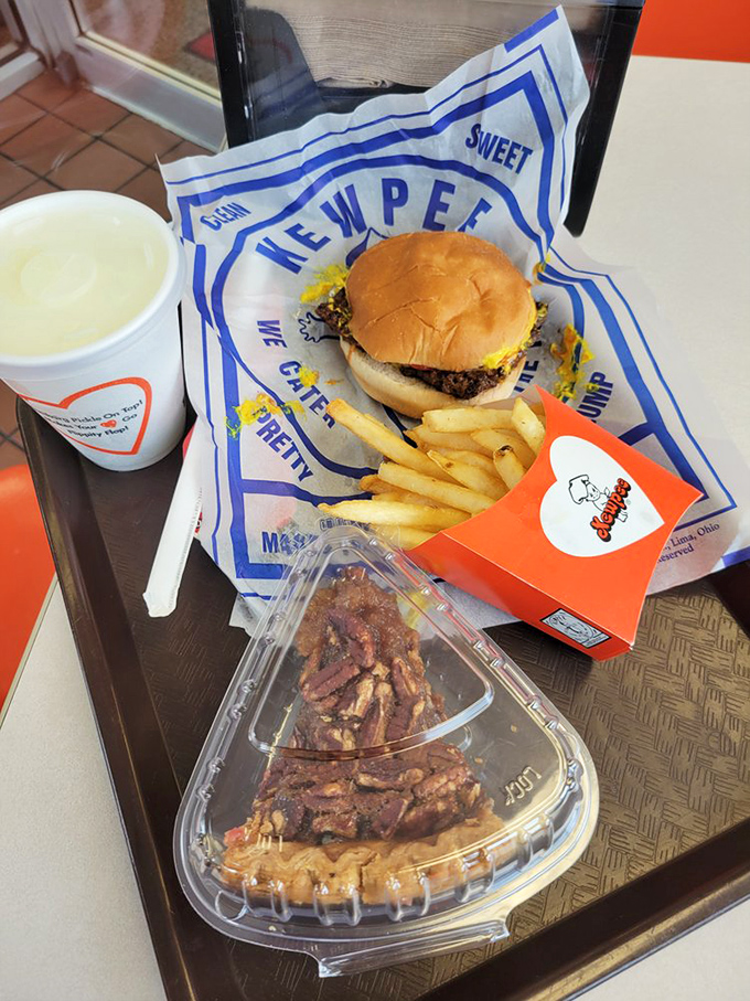 The holy trinity of Kewpee&mdash;burger, fries, and pie&mdash;arranged on a tray like artifacts in a museum dedicated to comfort food perfection.