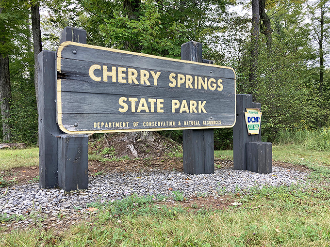 The entrance sign promises a state park, but what it delivers is a portal to another dimension—one where city lights don't dare interfere.