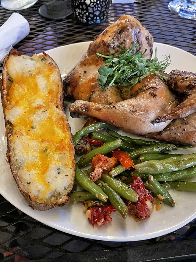 That cheese-topped potato alongside herb-roasted chicken is the kind of supporting actor that steals every scene it's in.
