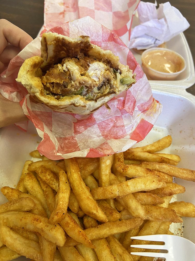 The wrap reveals its secrets mid-bite&mdash;crispy chicken nestled with fresh veggies. It's the mullet of meals: business outside, party inside.