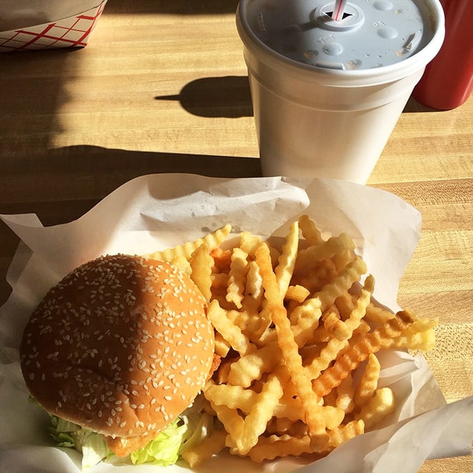 The holy trinity of fast food satisfaction: a perfect burger, crispy fries, and a drink large enough to hydrate a small village.
