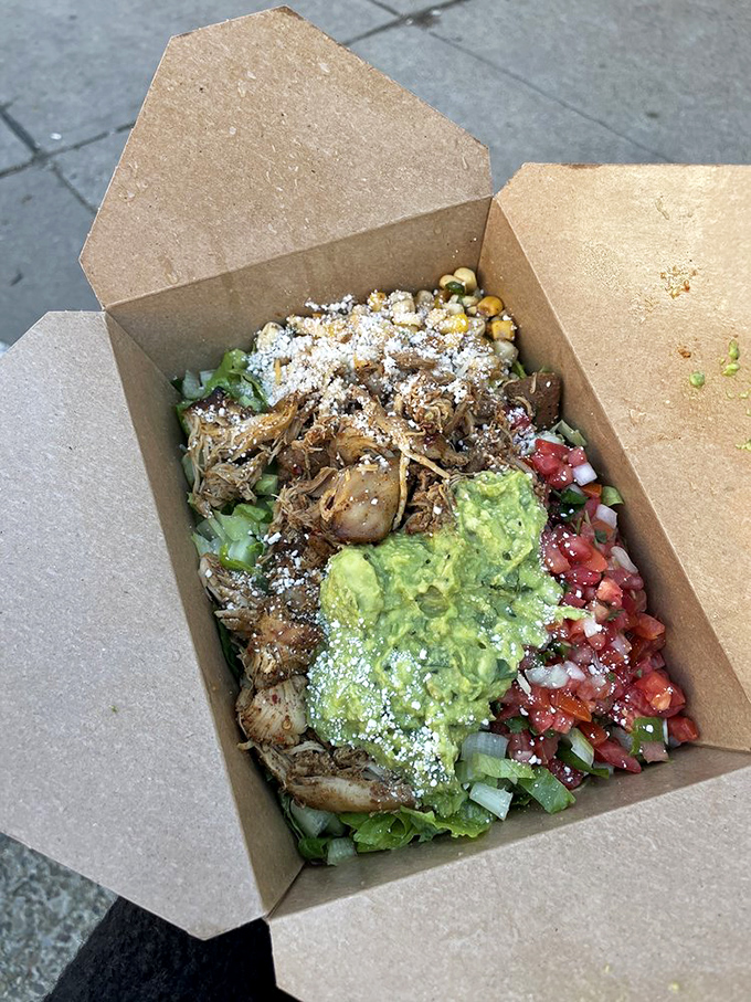 Some taco salads are sad affairs. This one's a celebration in a box&mdash;complete with guacamole dollop that deserves its own theme music.