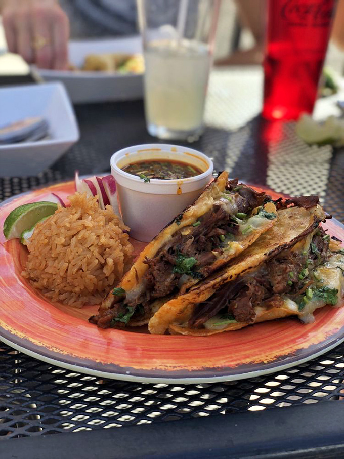 Birria tacos: where slow-cooked beef meets melted cheese in a relationship so perfect it should have its own reality show.