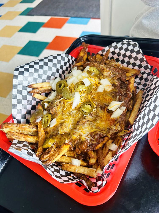 Chili cheese fries: where dignity goes to die and happiness comes to live, topped with jalape&ntilde;os for those who like their joy with a kick.
