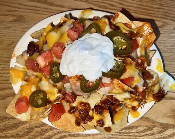 These nachos aren't just a snack, they're an architectural achievement with layers of cheese, jalape&ntilde;os, and pure joy.