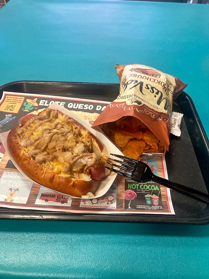 A study in contrasts: one classic dog with chili, one with vibrant Chicago-style fixings &ndash; proof that diversity in hot dog culture is something to celebrate.