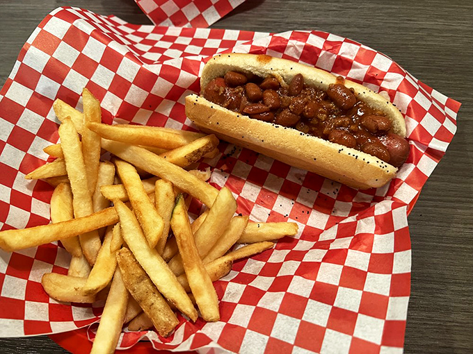The humble chili dog with a side of golden fries&mdash;comfort food that speaks a universal language of satisfaction.