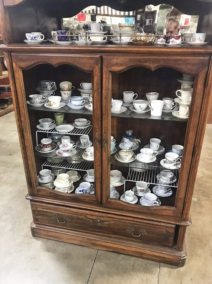 This antique cabinet showcases teacups that have witnessed decades of conversations&mdash;each one holding stories along with your Earl Grey.