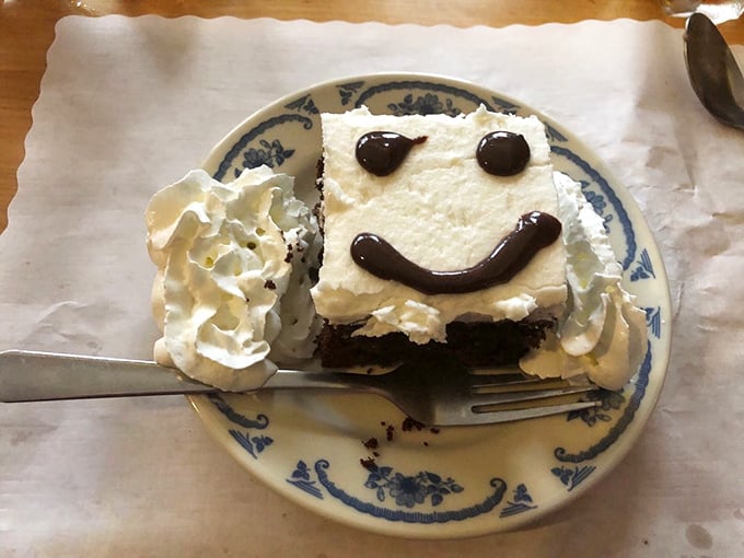 Someone drew a smile on this chocolate cake, but let's be honest—you were already grinning at the mere sight of it.