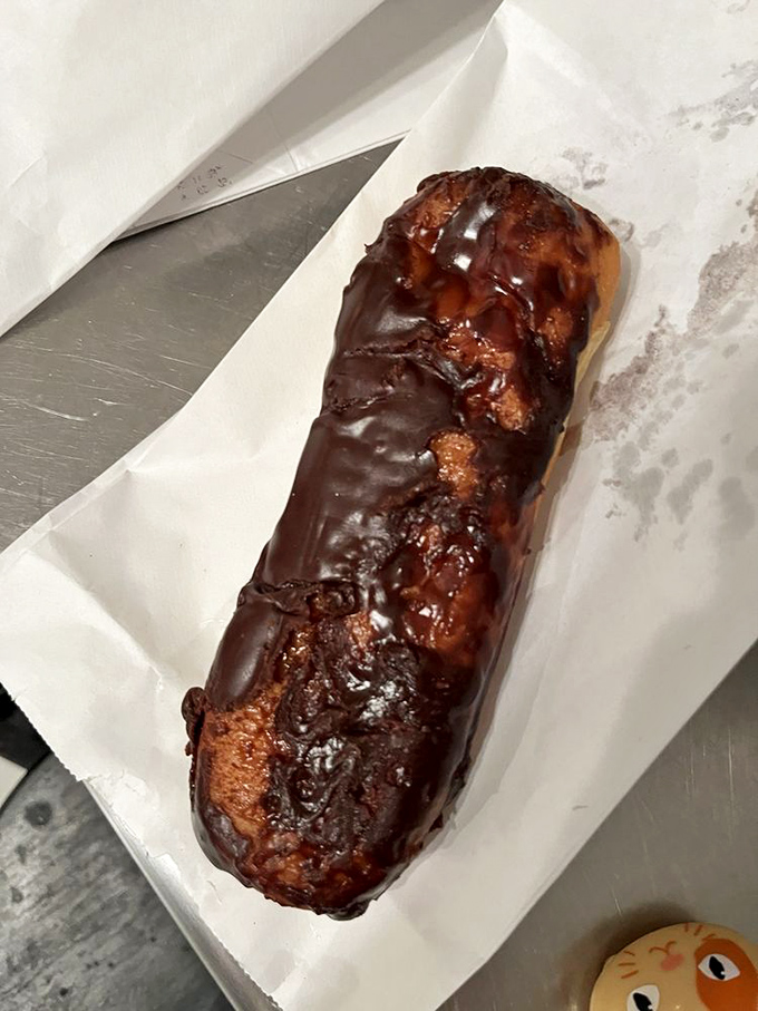 The chocolate long john&mdash;a rectangular promise of bliss that makes you wonder why circles get all the donut glory.