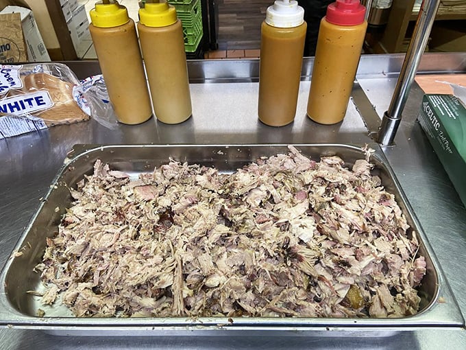 Mountains of hand-chopped pork await their destiny, ready to be transformed into sandwiches that will haunt your dreams for weeks to come.