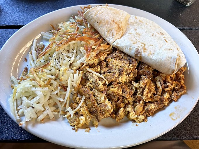 Breakfast burrito the size of your forearm, served with a side of vegetables to ease your conscience. Balance is everything.