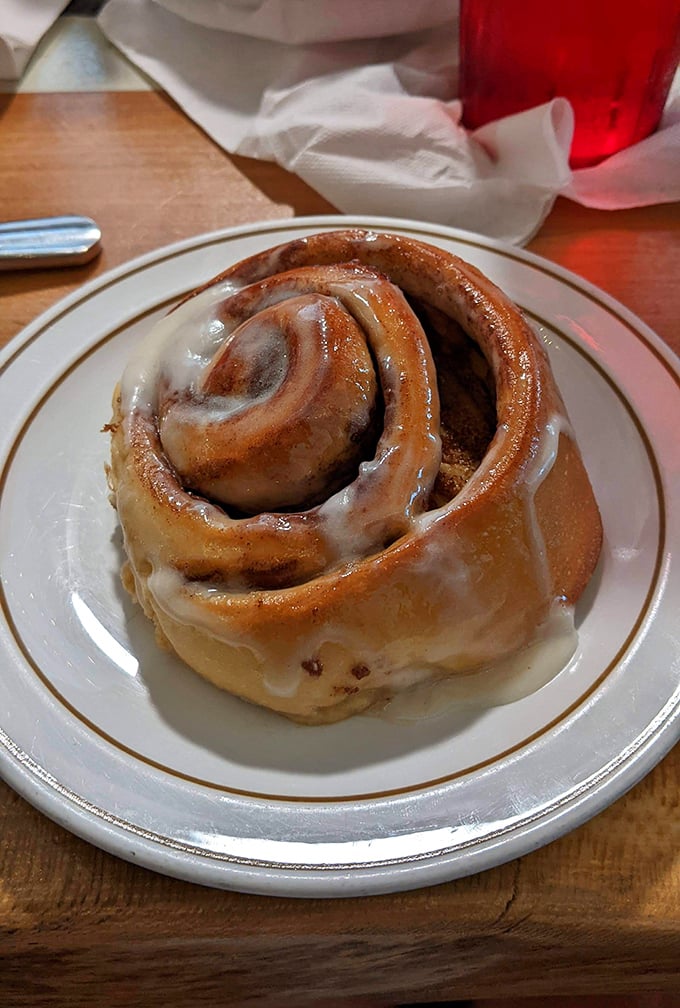 This isn't just any cinnamon roll&mdash;it's the heavyweight champion of breakfast indulgence, glistening with icing that melts into every warm crevice.