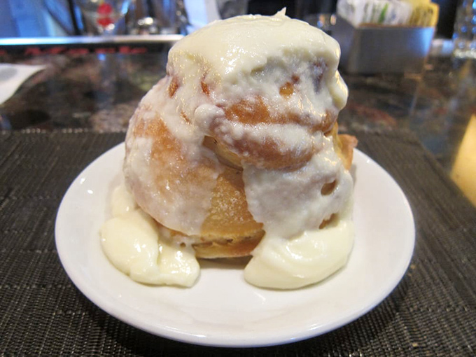 This cinnamon roll doesn't just have layers—it has chapters, plot twists, and a very happy ending swimming in vanilla frosting.