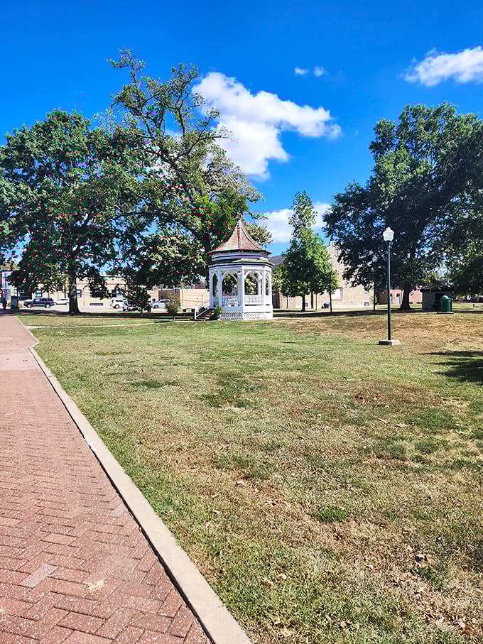 The classic gazebo stands like a time-traveling device to simpler days, when summer concerts and first kisses happened under wooden cupolas.