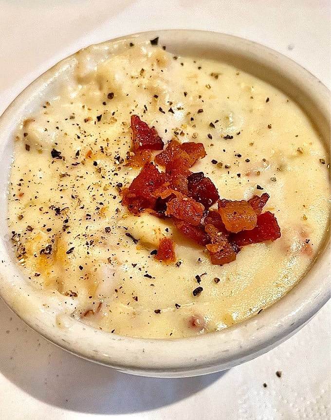 Those golden rolls in the background are practicing their supporting role, but the star is definitely that legendary bread&mdash;pillowy centers with crackling crusts.