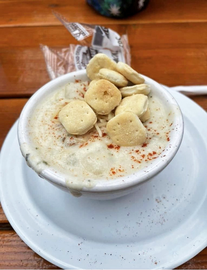 This clam chowder isn't just soup—it's a warm hug in a bowl, topped with oyster crackers like little life rafts on a creamy sea.