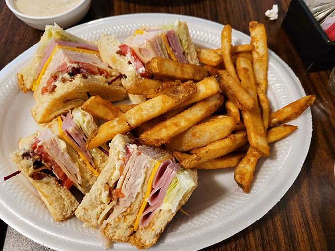 The club sandwich&mdash;architecture you can eat. Three stories of deliciousness held together by toothpicks and tradition.