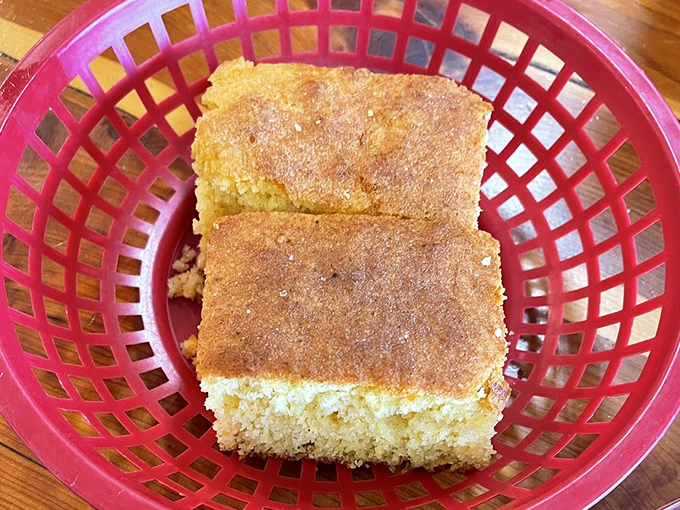 Cornbread that strikes the perfect balance between sweet and savory, arriving in a basket like a golden gift from the Southern gods.