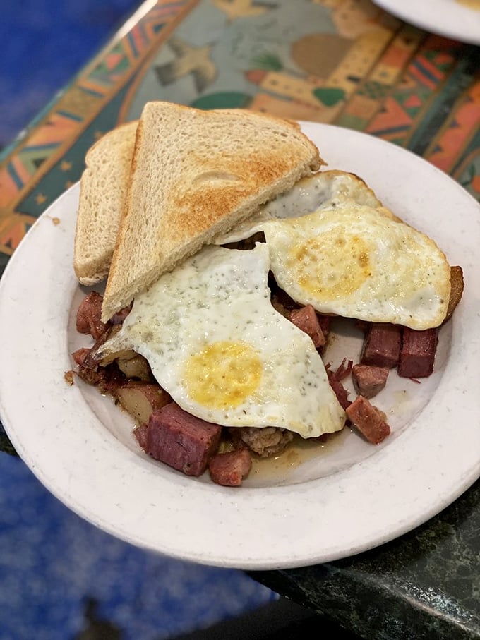 Corned beef hash crowned with perfectly fried eggs &ndash; the breakfast equivalent of finding an extra $20 in your winter coat pocket.