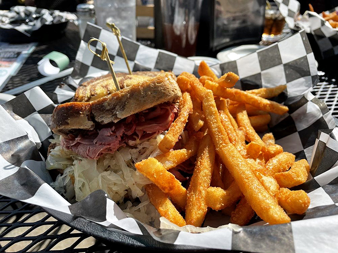 A Reuben sandwich that stands tall and proud, with corned beef piled high enough to make Manhattan delis nod in respect.
