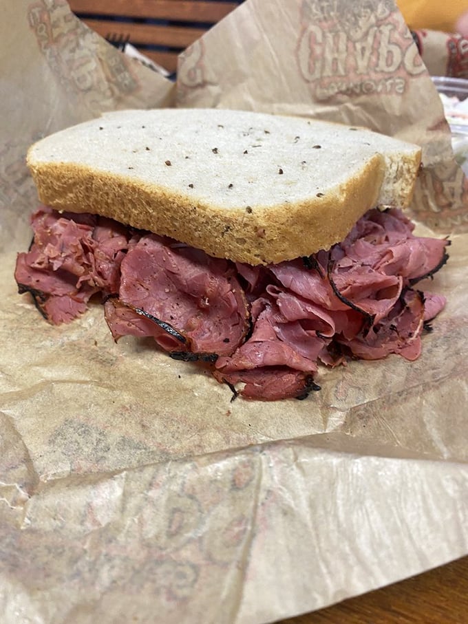 Corned beef piled higher than your weekend expectations. This sandwich doesn't just satisfy hunger &ndash; it obliterates it.