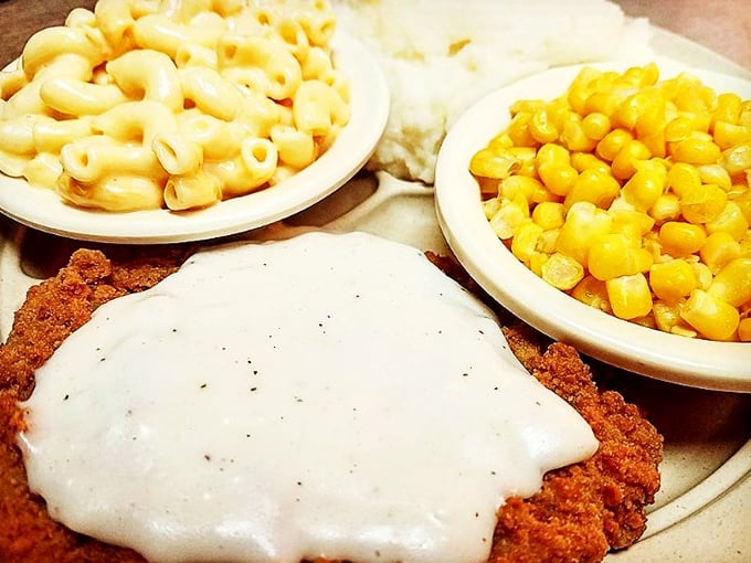 Country fried steak smothered in gravy alongside mac and cheese that's clearly never met a powdered mix&mdash;this is comfort food that hugs you from the inside.