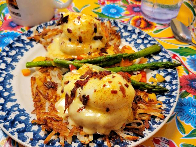 Eggs Benedict gets the royal treatment with delicate hollandaise cascading over perfectly poached eggs. Breakfast as art form.