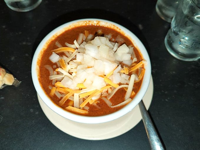 Hearty homemade chili topped with cheese and onions—the kind that warms both body and soul on chilly Missouri afternoons.