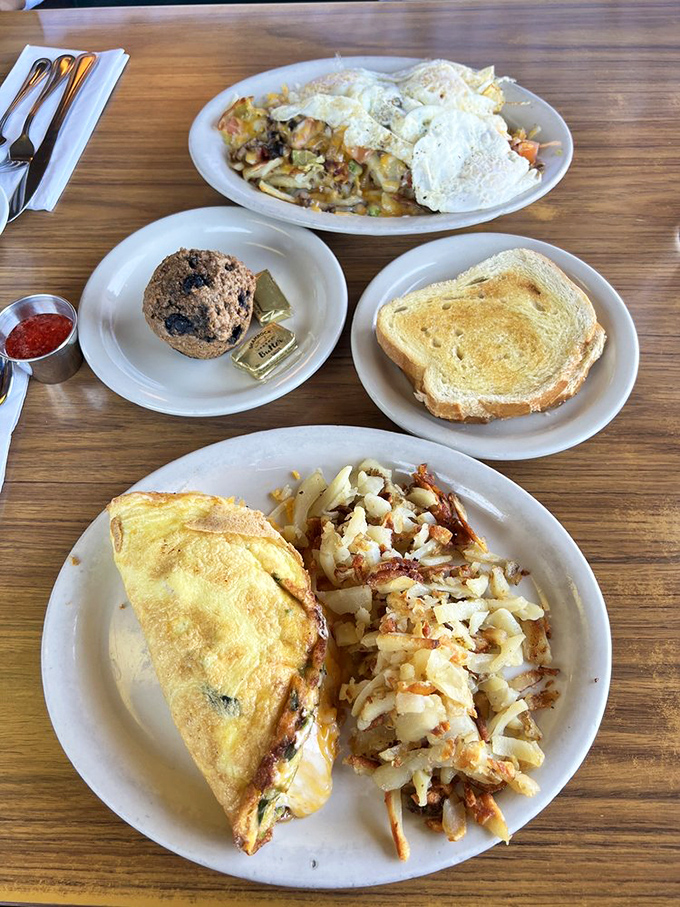 This Denver omelet looks like it's wearing a cheese cape while the Buffalo Chips stand ready to steal the spotlight.