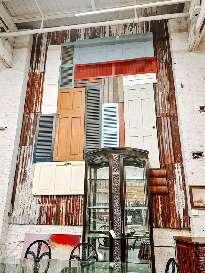 The door display resembles a Mondrian painting made of salvaged entryways. Each one has welcomed countless guests and is ready for its next chapter.