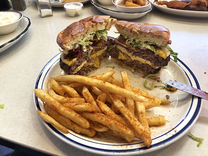 The burger that makes you forget your table manners. Split down the middle to reveal its soul&mdash;this is architecture you can eat.