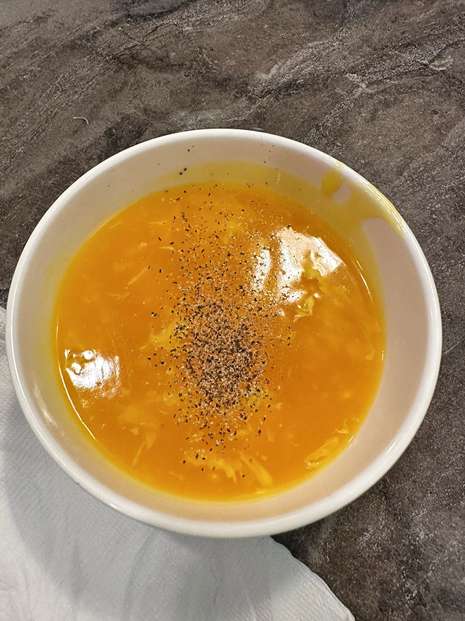 Egg drop soup that's sunshine in a bowl. Those delicate ribbons of egg swimming in golden broth are the comfort food equivalent of a warm hug.