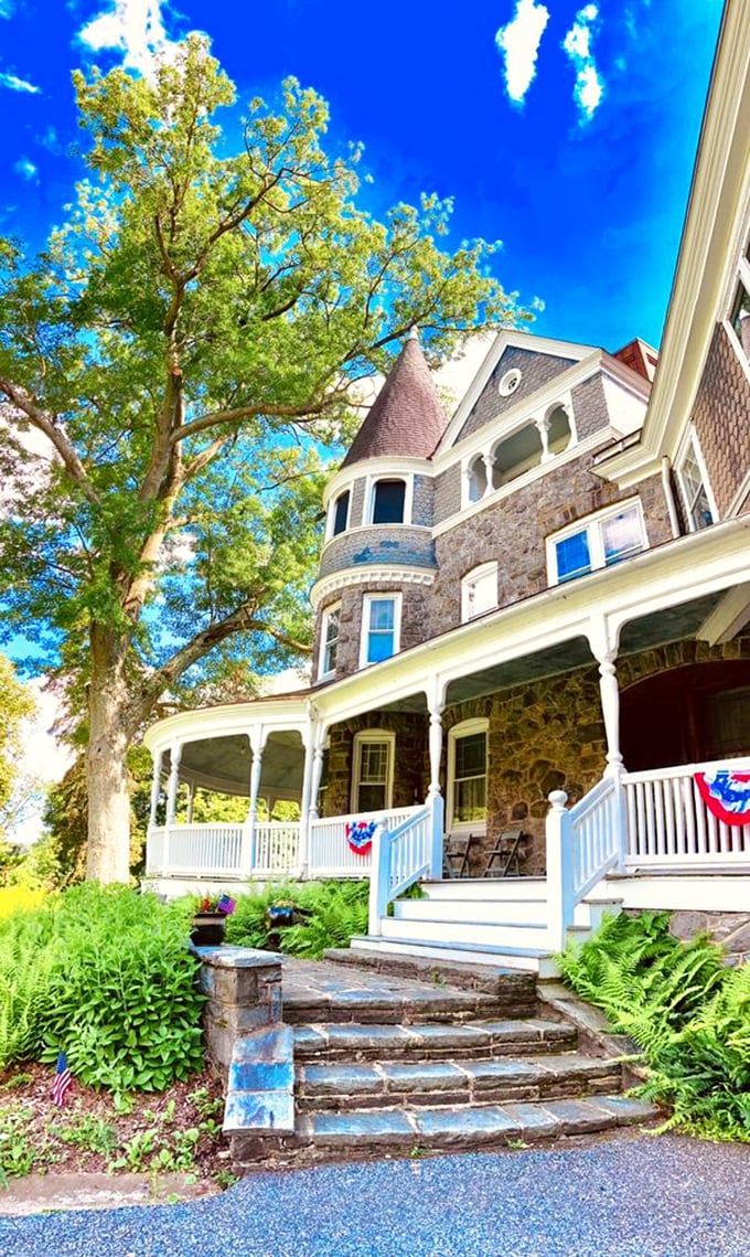 Auburn Heights' stone facade and white columns create a postcard-perfect welcome. Under that blue Delaware sky, even the architecture seems to smile.