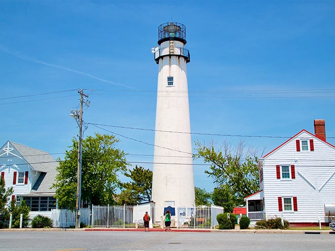 The lighthouse's clean lines against clear blue skies &ndash; a postcard-perfect scene that hasn't changed much in over a century.